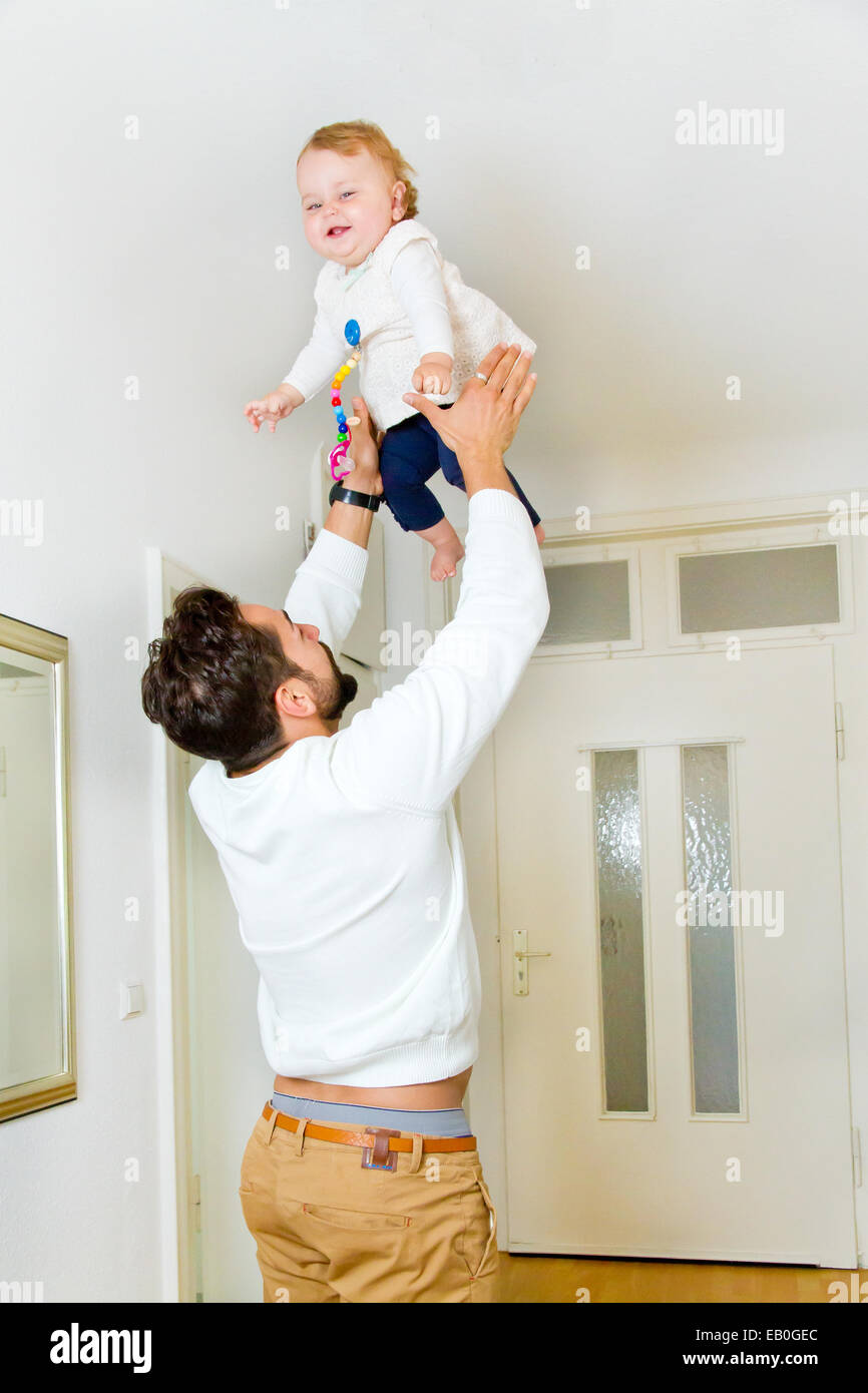 Happy father tossing his baby Stock Photo - Alamy