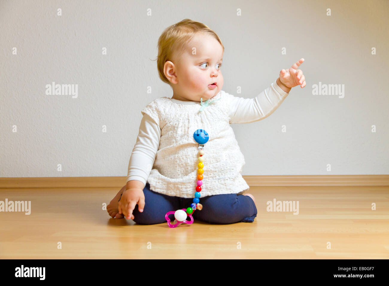 Happy, curious baby at home Stock Photo - Alamy