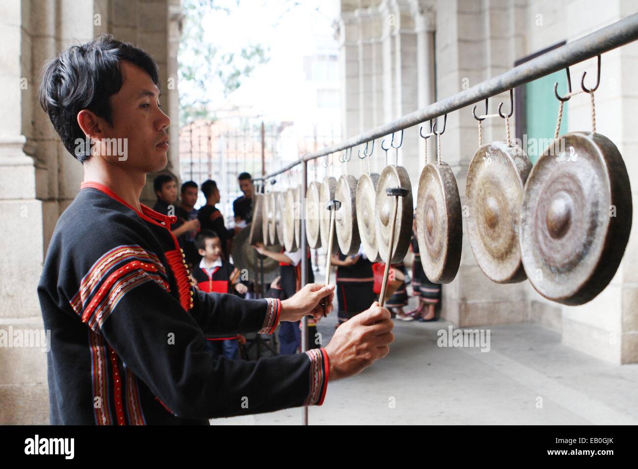 Ho Chi Minh City, Vietnam. 23rd Nov, 2014. A man plays local Highlands ...