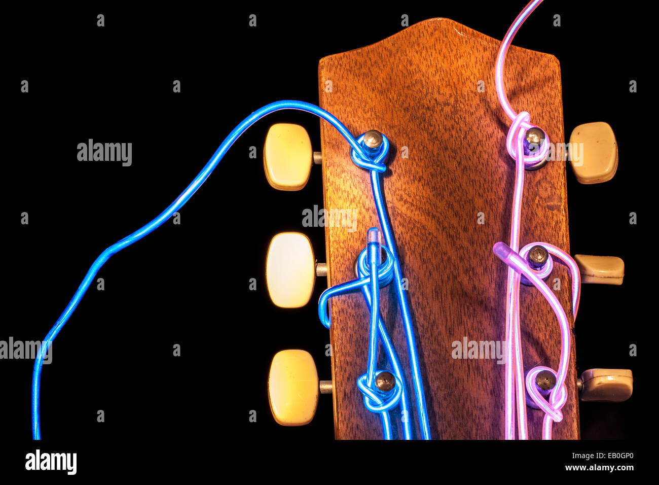 Acoustic guitar with strings removed and substituted with electro ...
