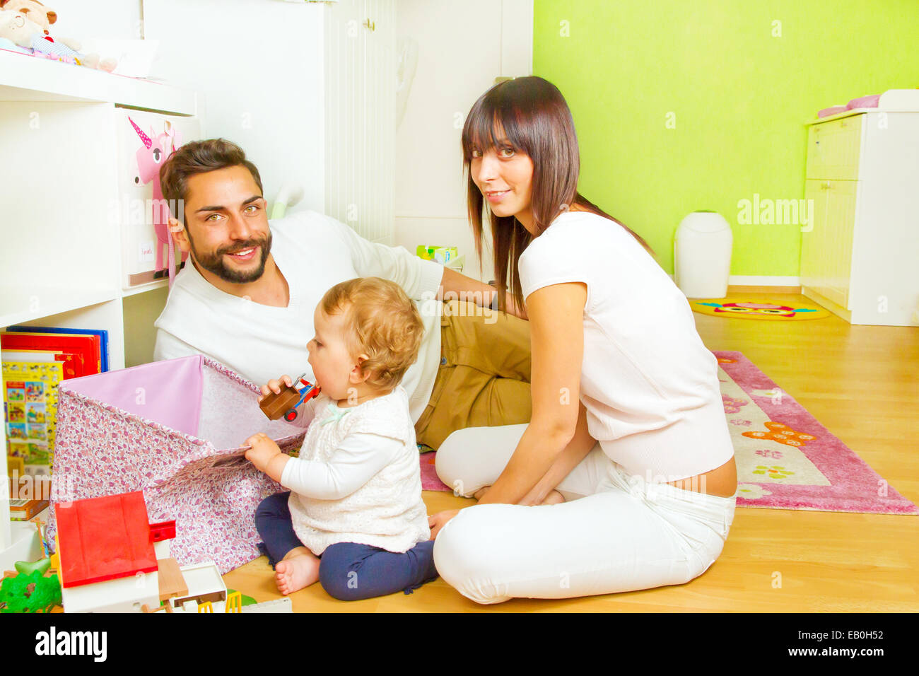 Young happy and modern family in their modern home Stock Photo - Alamy