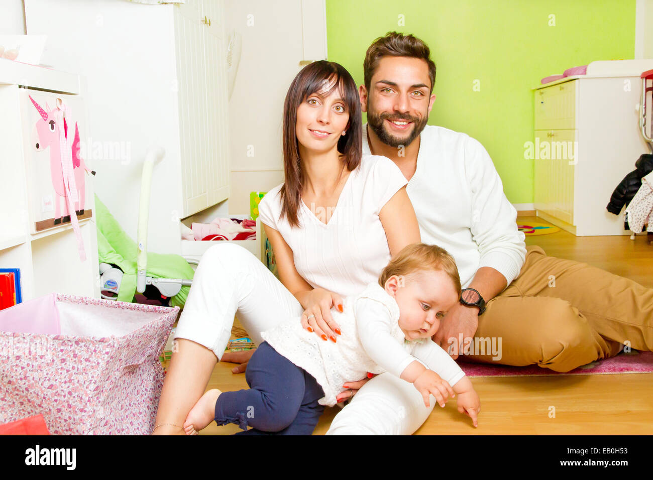 Young happy and modern family in their modern home Stock Photo - Alamy