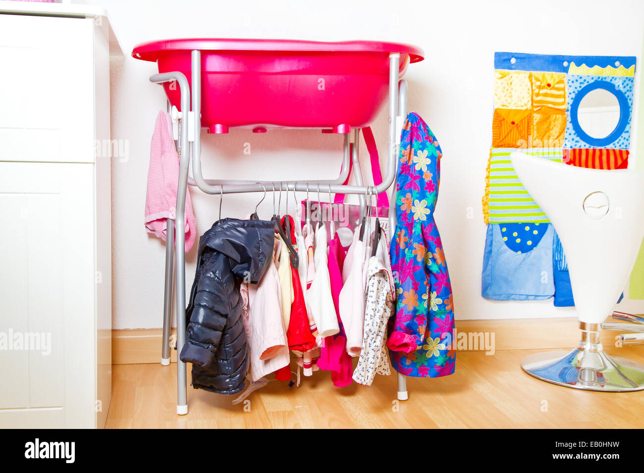 Colorful clothes in children´s room Stock Photo - Alamy