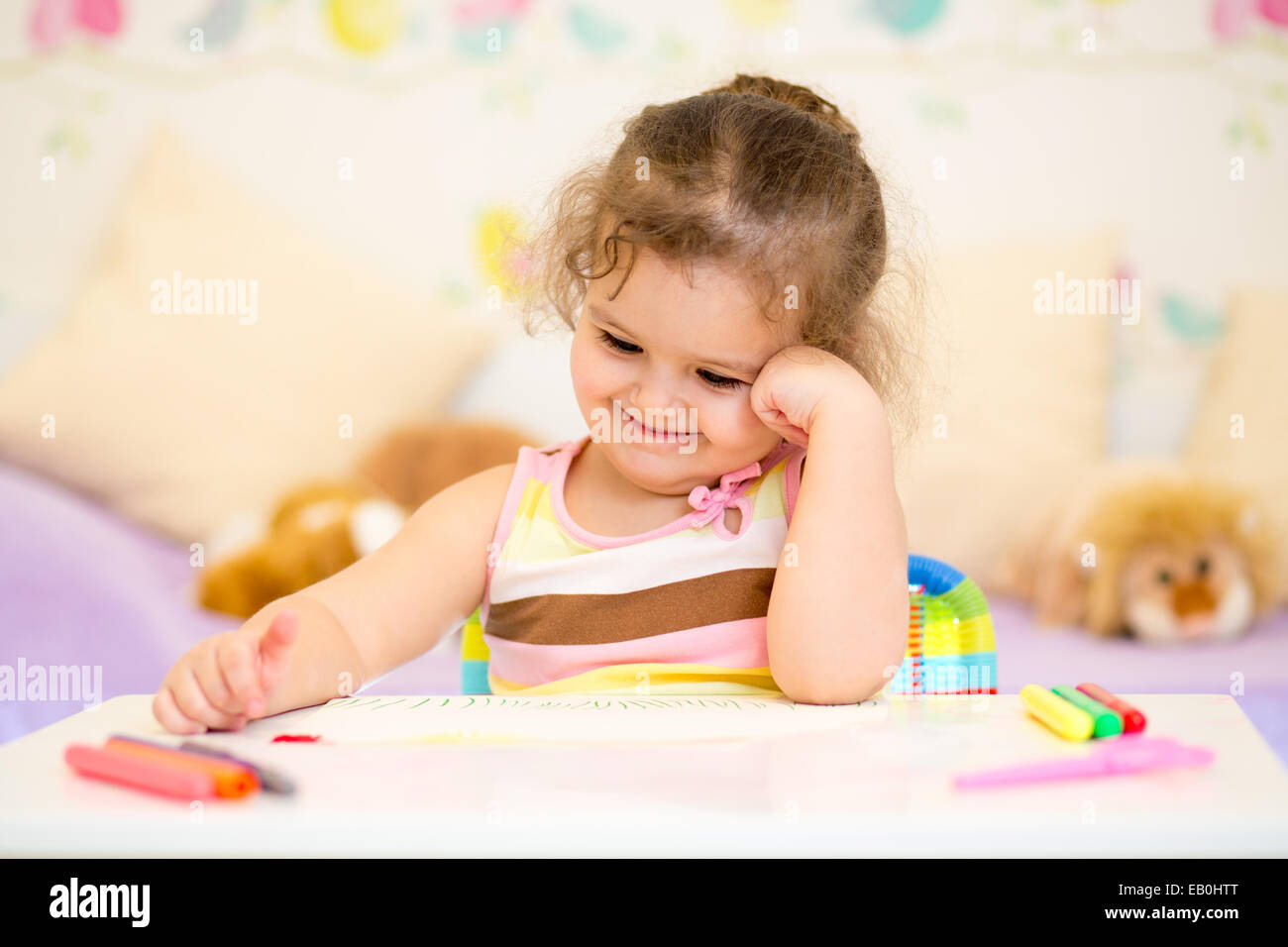 child girl drawing in nursery Stock Photo - Alamy