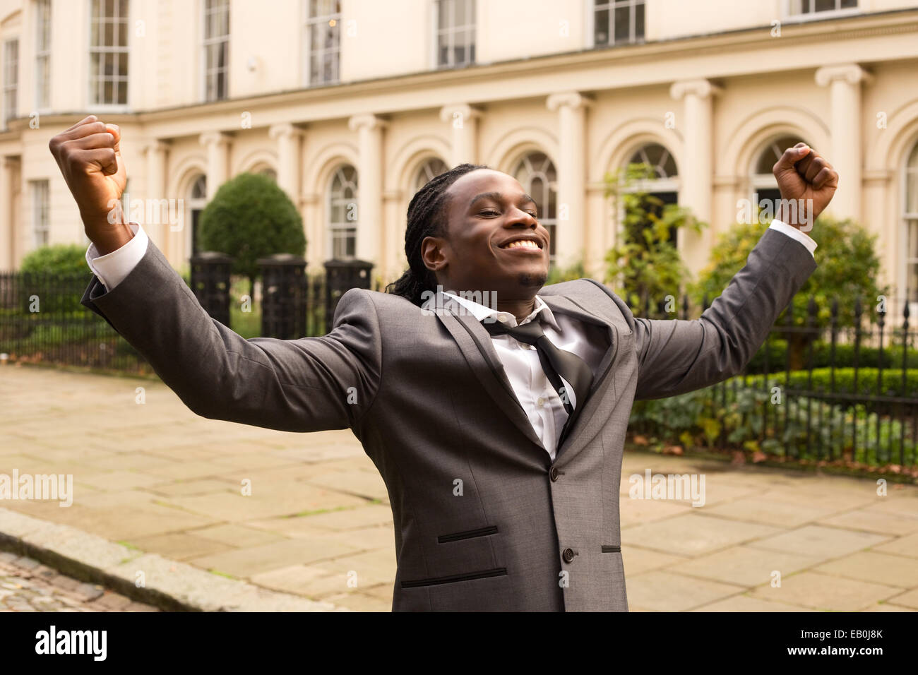 Winning african man celebrating success hi-res stock photography and ...