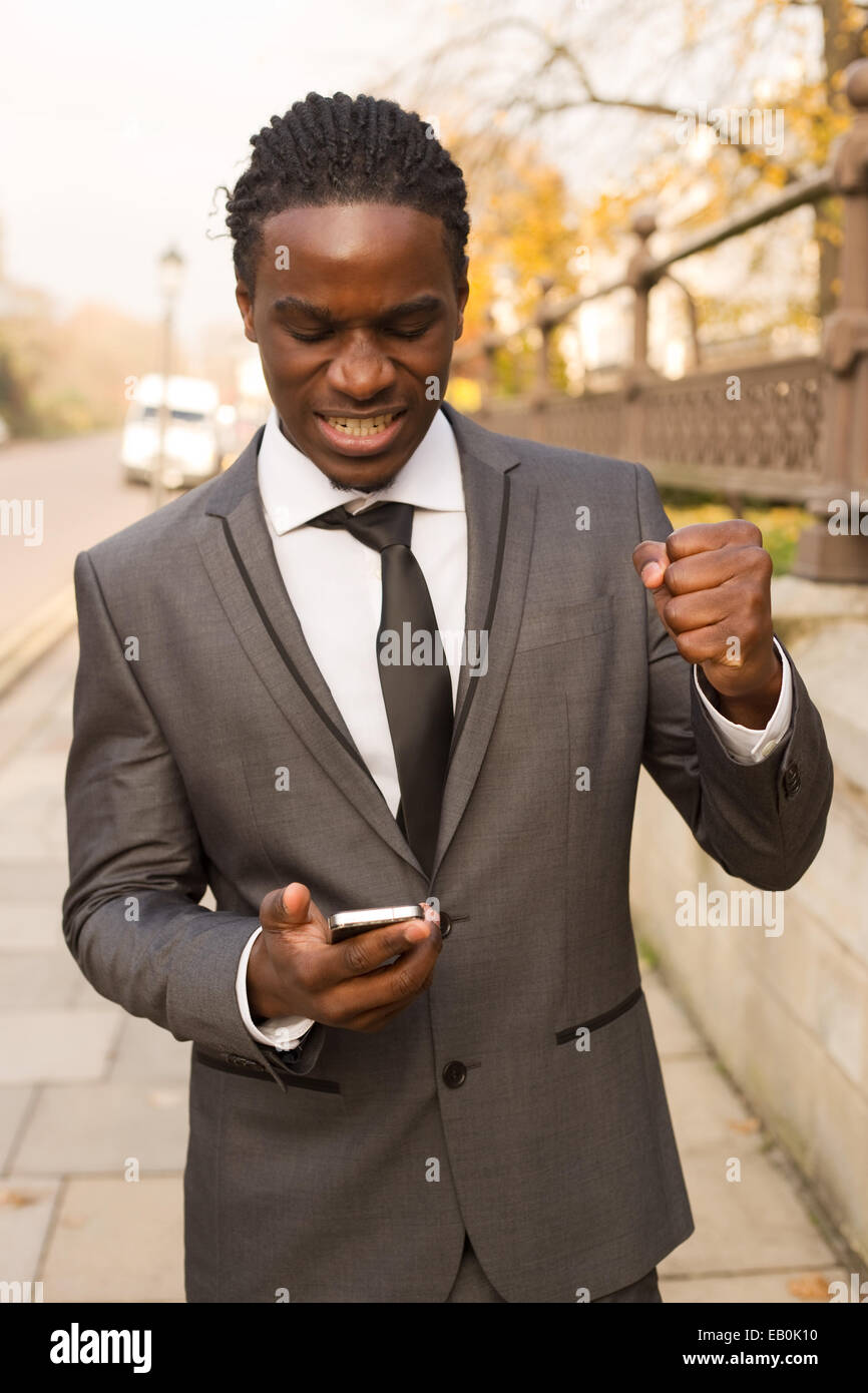 frustrated business man reading a text message Stock Photo - Alamy