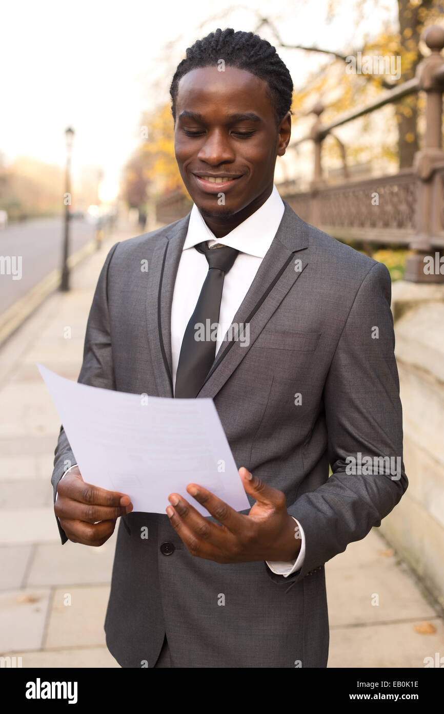 Young entrepreneur reading document hi-res stock photography and images ...