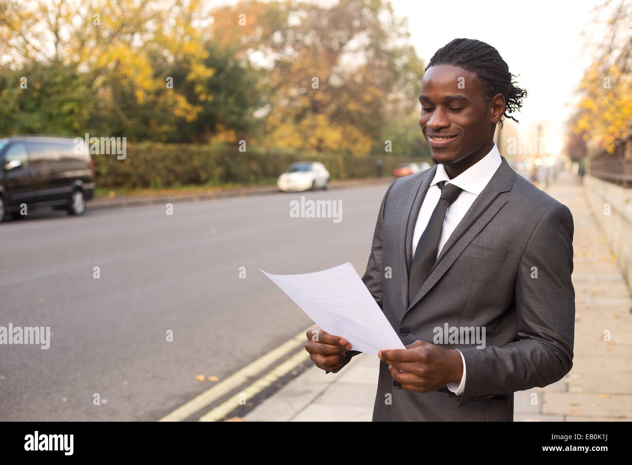 young business man reading a form Stock Photo - Alamy