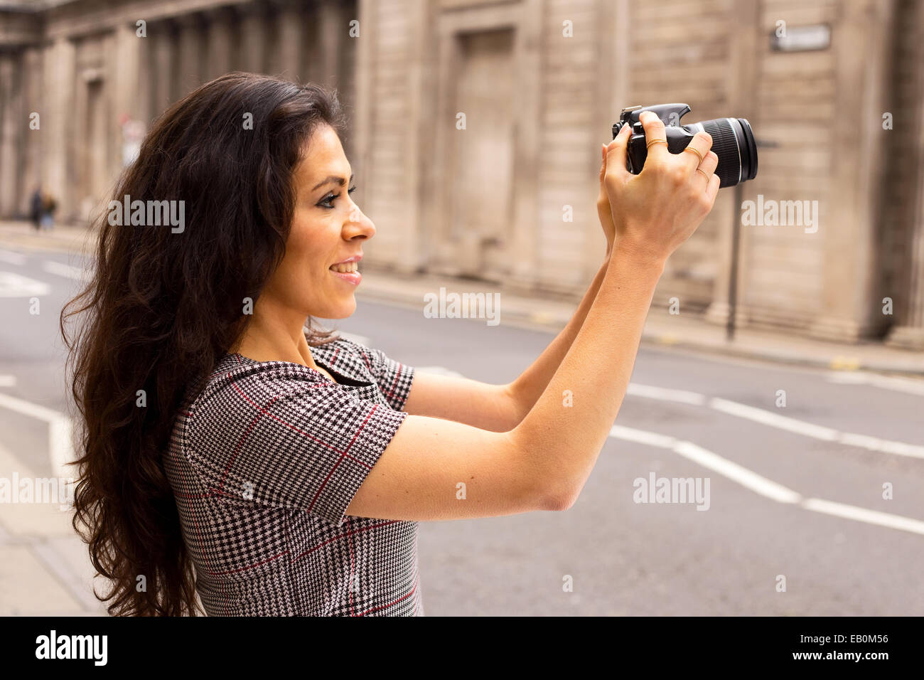 Lady taking pictures slr hi-res stock photography and images - Alamy
