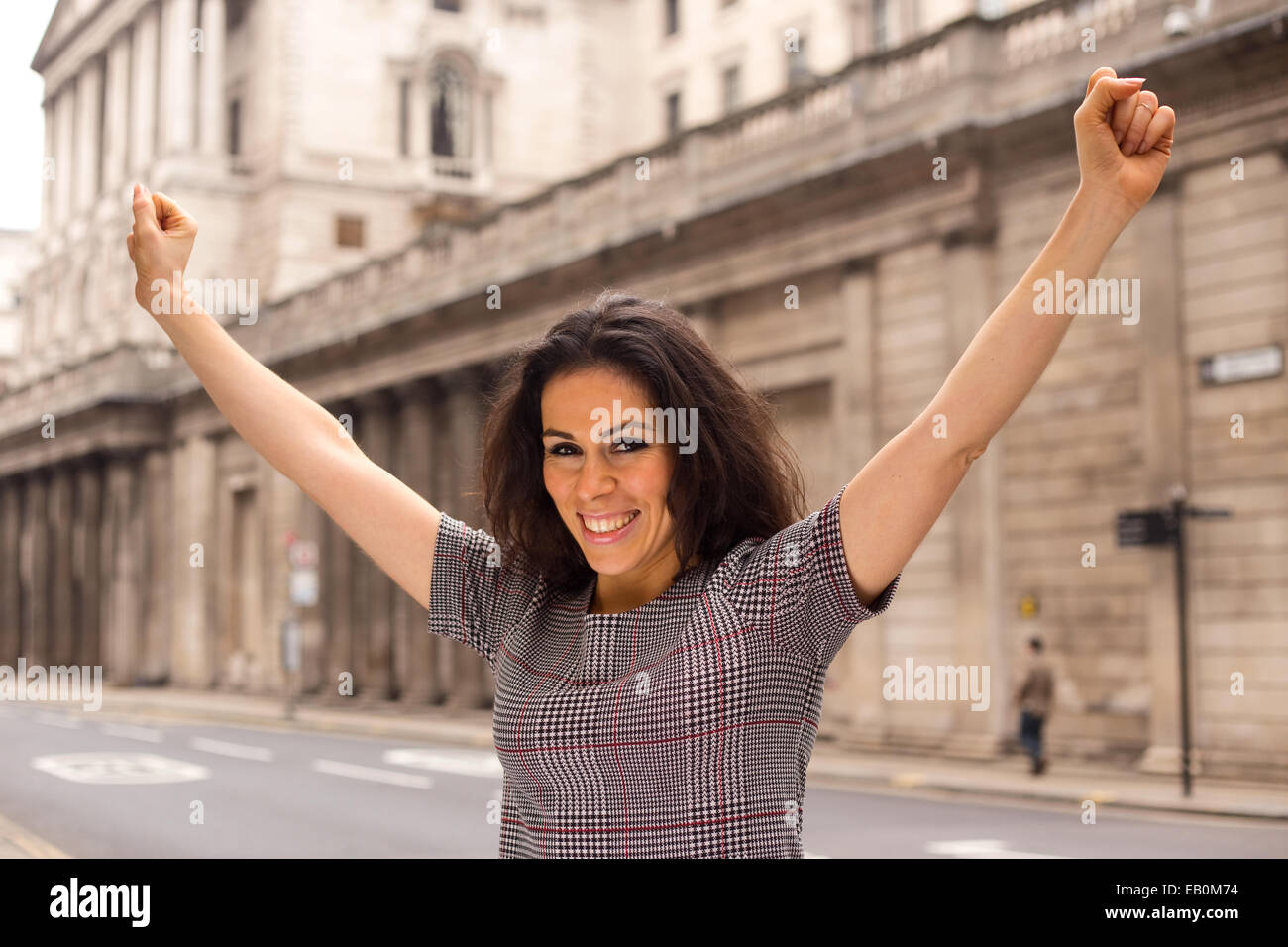 young woman celebrating with arms outstretched Stock Photo - Alamy