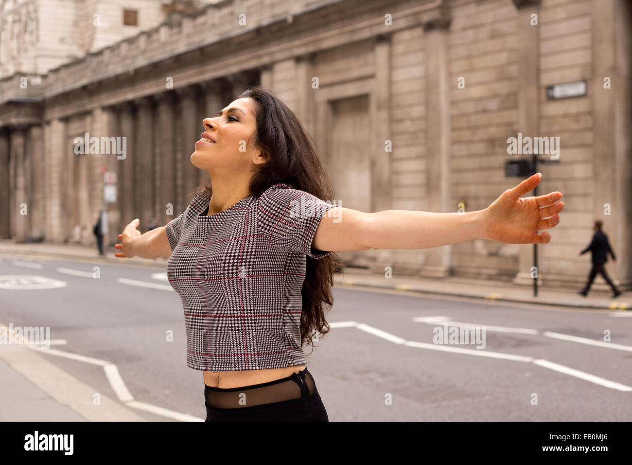 young woman enjoying the city air Stock Photo - Alamy