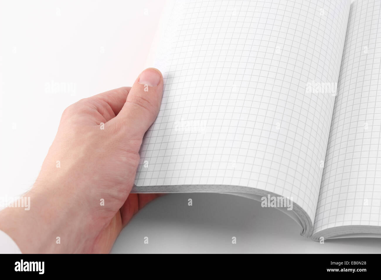 Notebook in hand closeup on white background Stock Photo - Alamy