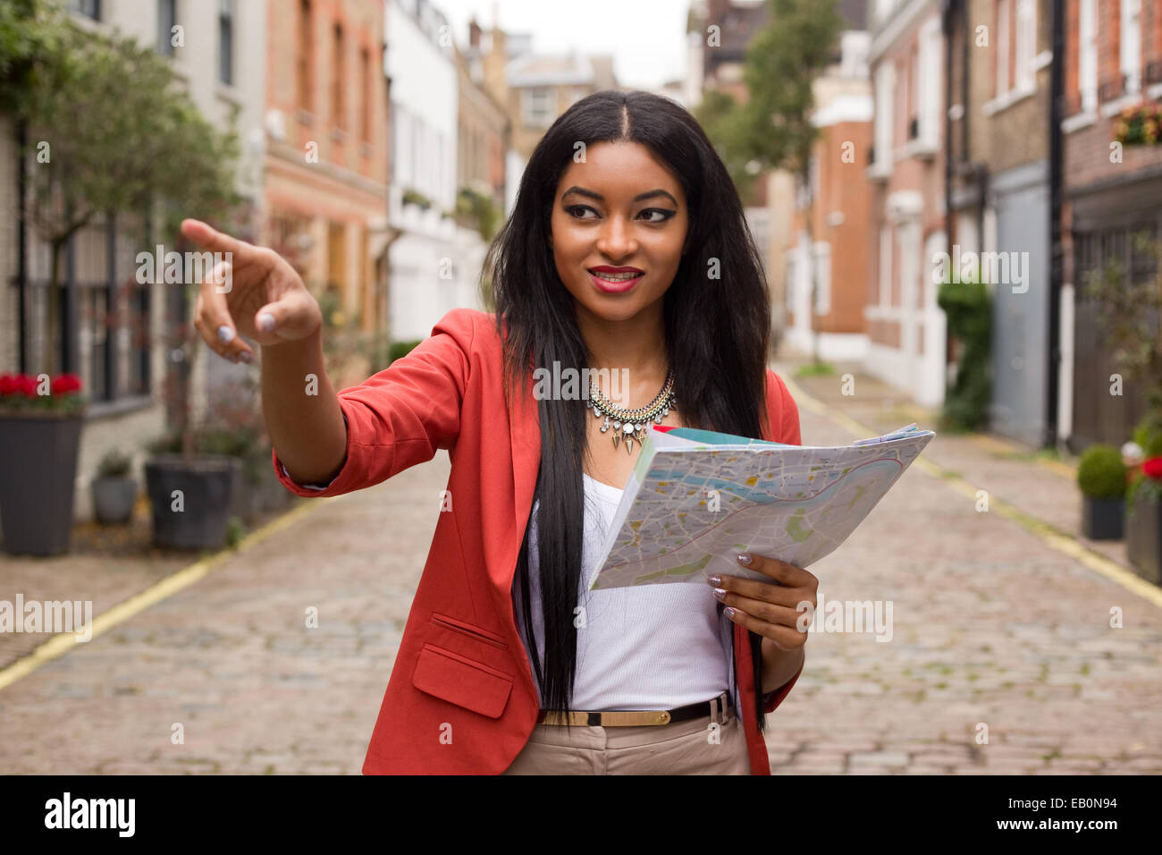 Female pointing at map hi-res stock photography and images - Alamy