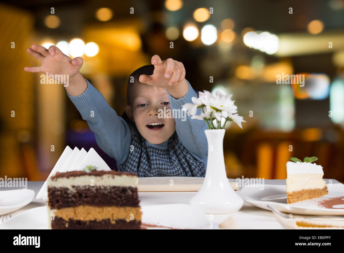 Reaching for cake hi-res stock photography and images - Alamy