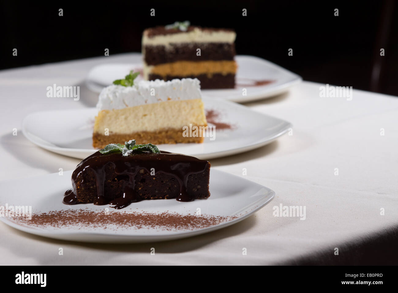 Selection of desserts at a restaurant with a diagonal line of three ...