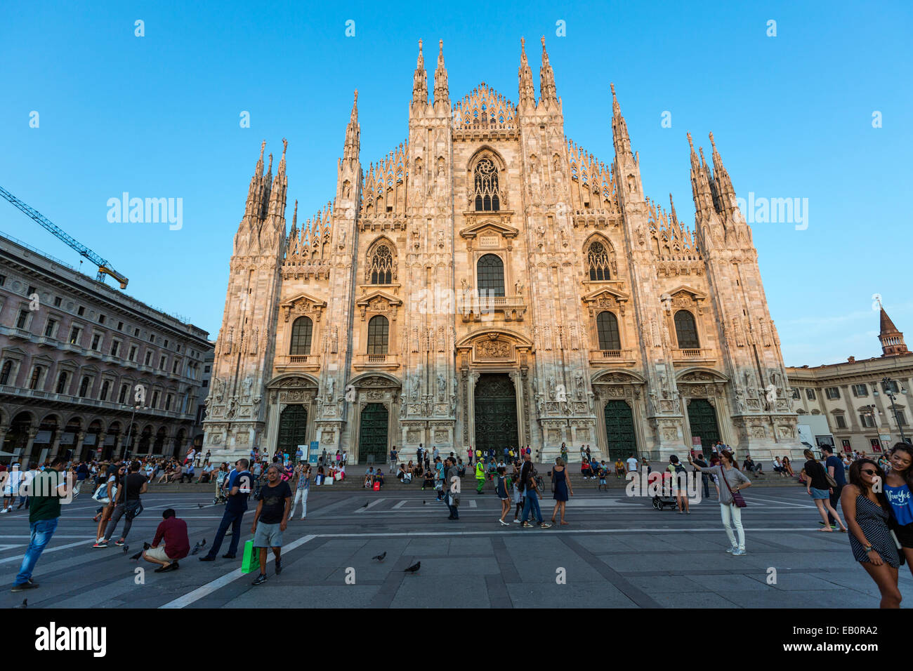 Tourists in front of the Duomo di Milano at sunset Cathedral church of ...