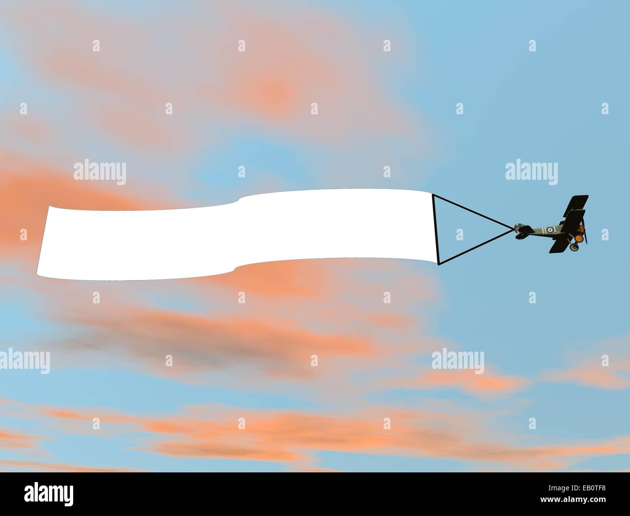 Biplane aircraft pulling advertisement banner in colorful sunset sky ...