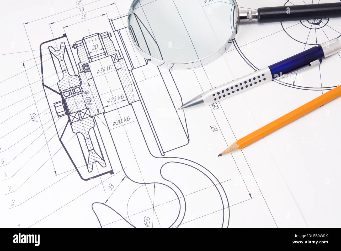 drafting of crane hook with pencil, pen and magnifier Stock Photo - Alamy