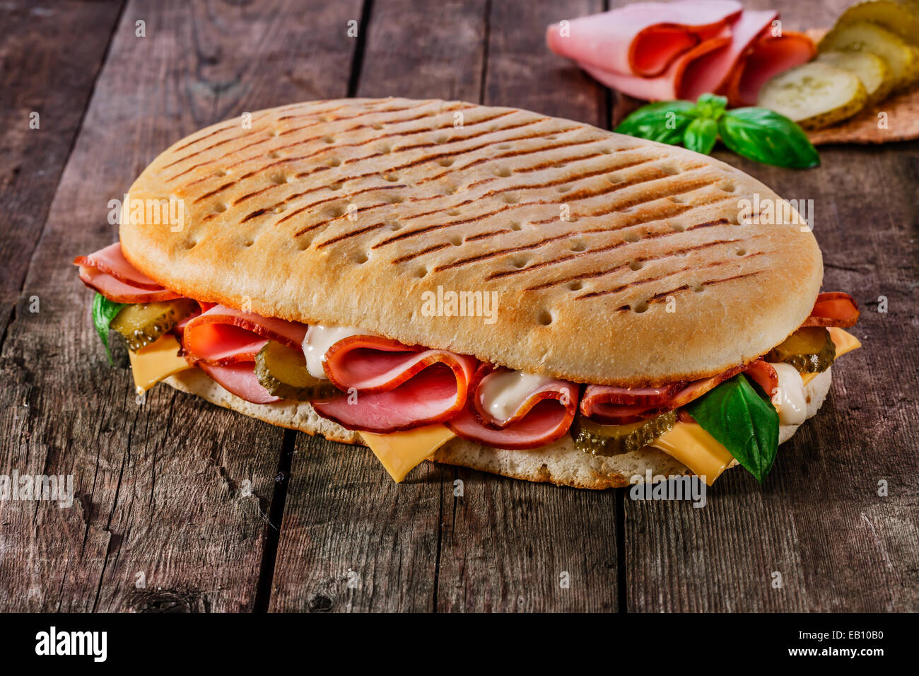 Grilled panini with ham and cheese Stock Photo - Alamy