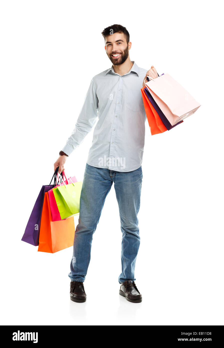 Handsome man holding shopping bags. Christmas and holidays concept ...