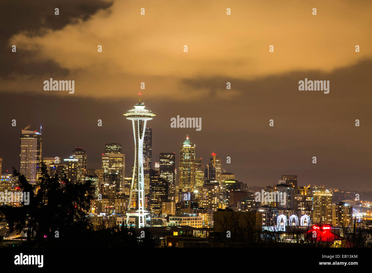 The lovely Seattle skyline at night with clouds leading into and out of ...