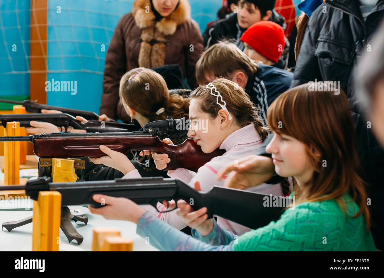 Belarusian secondary school pupils girls shooting an air rifle at a ...