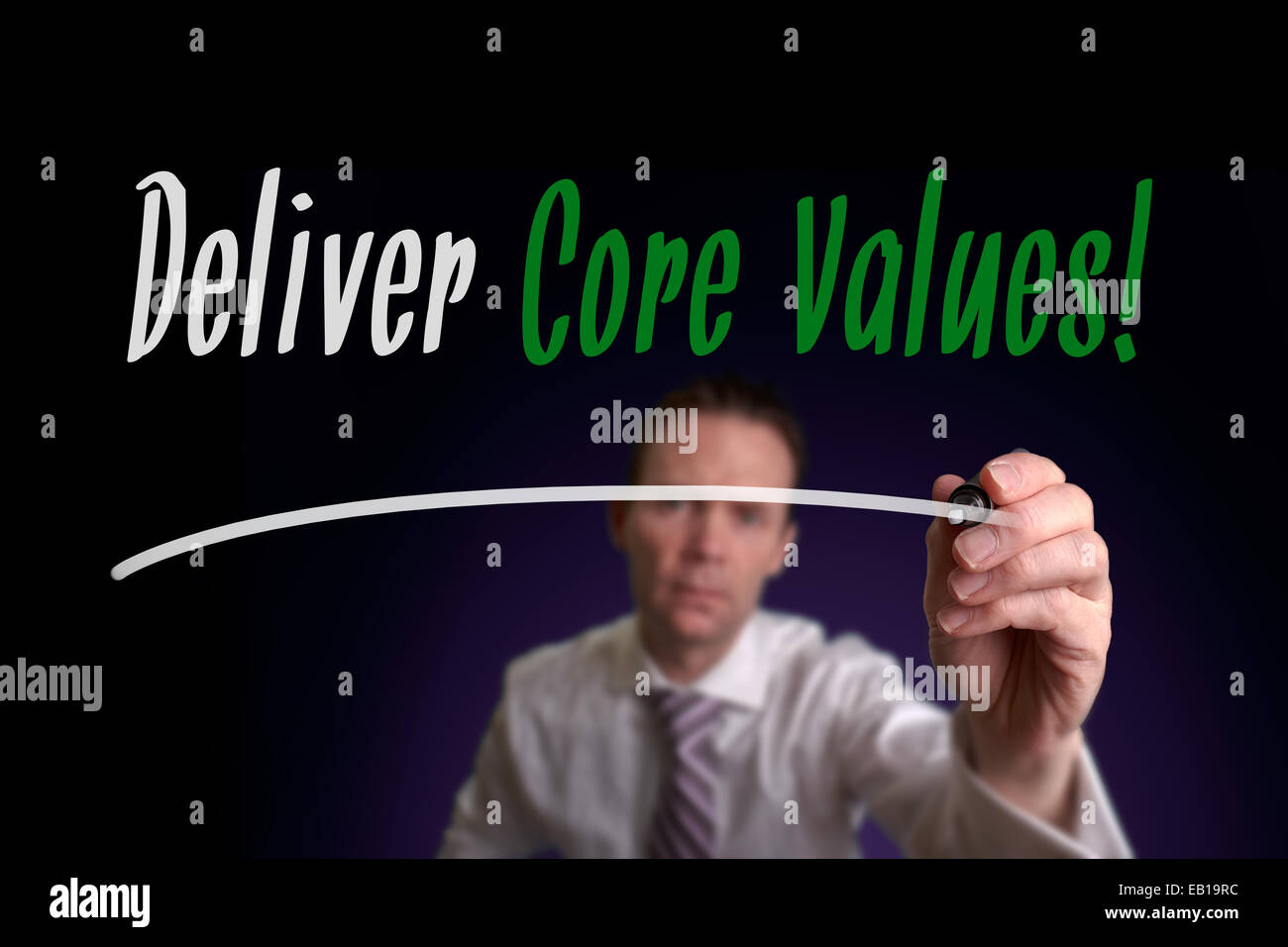A businessman writing Deliver Core Values on a screen. Business Concept ...