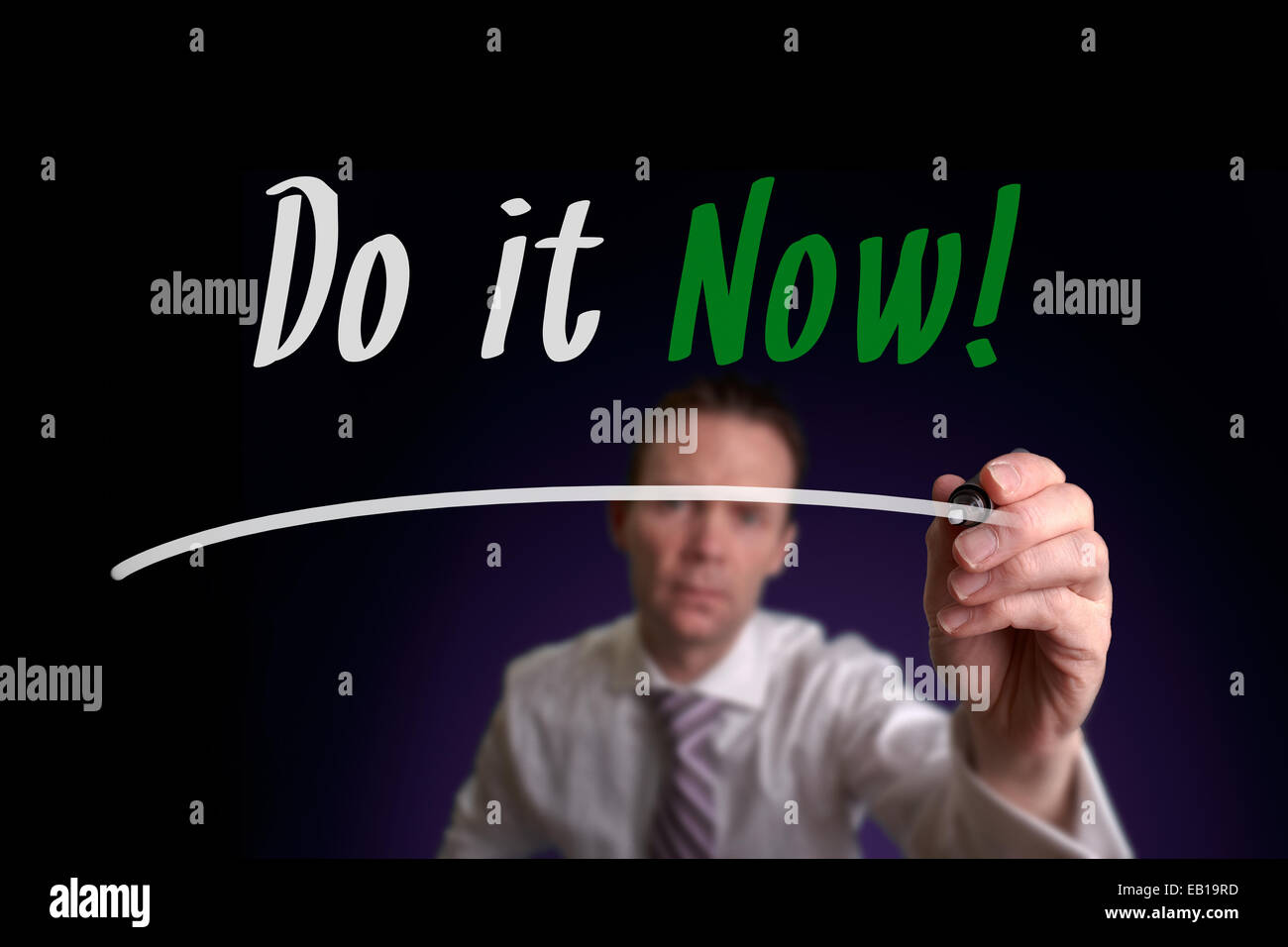 A businessman writing Do it Now on a screen. Business Concept Stock ...