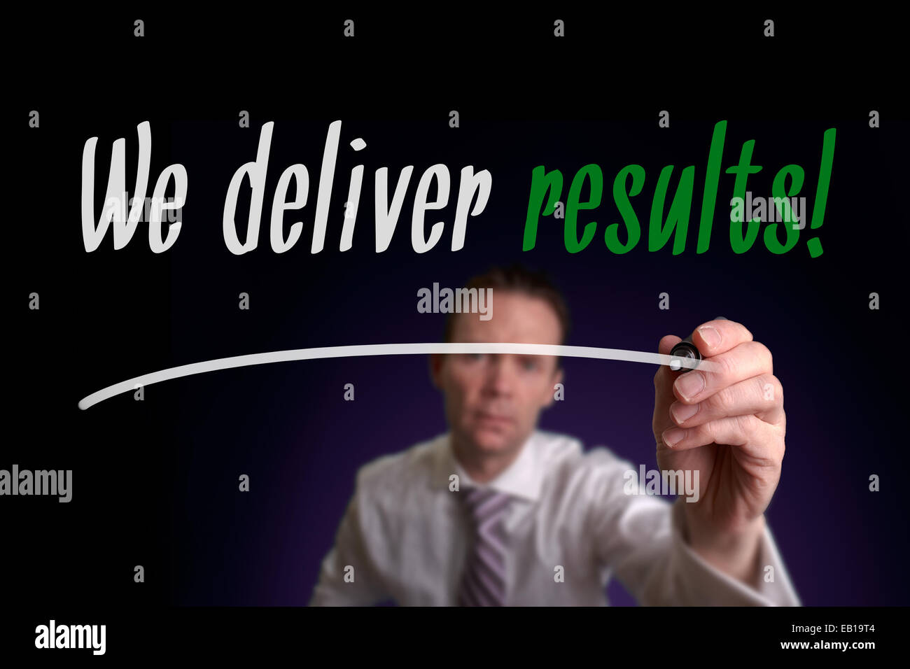 A businessman writing We Deliver Results on a screen. Business Concept ...