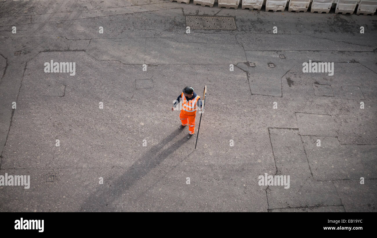 Banksman traffic marshall with fluorescent suit and helmet with stop ...