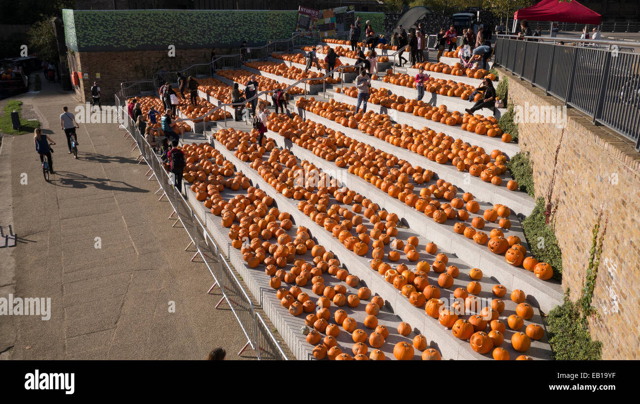Canalside steps Kings Cross London with rows of pumpkins during living ...