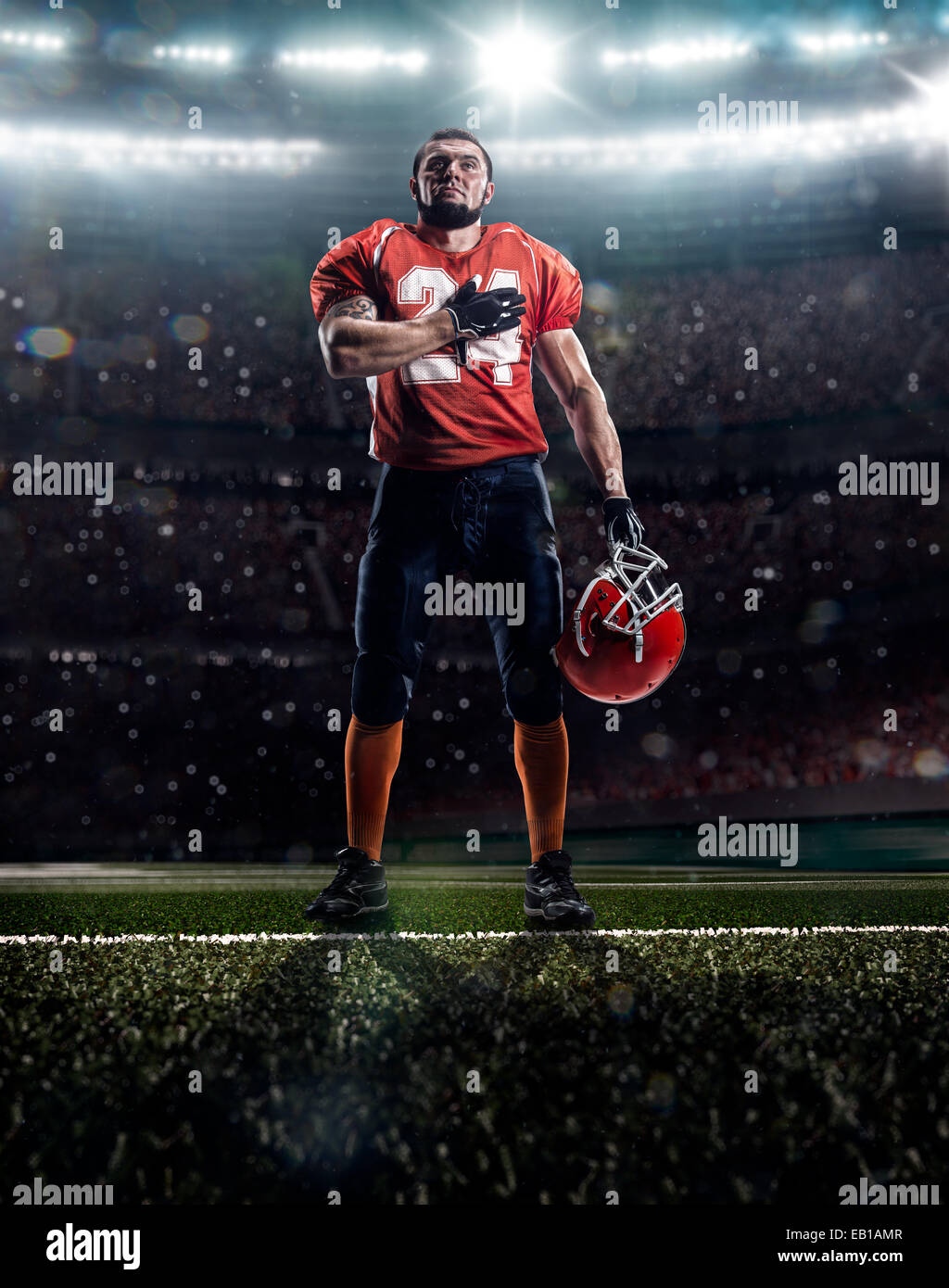 Proud american football player is praying before match Stock Photo - Alamy
