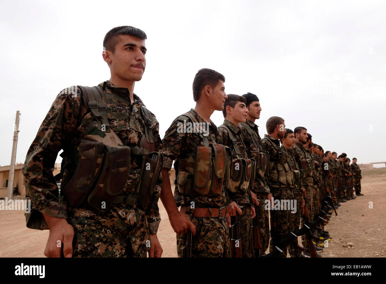 Kurdish fighters of the People's Protection Units YPG taking part in a ...