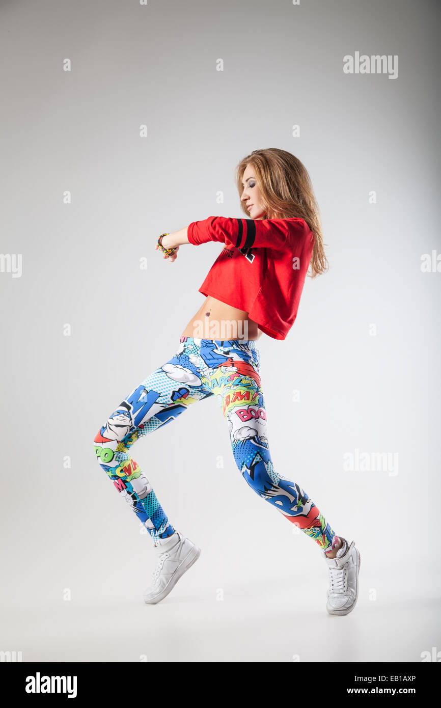 Modern dancer poses in front of gray studio background Stock Photo - Alamy