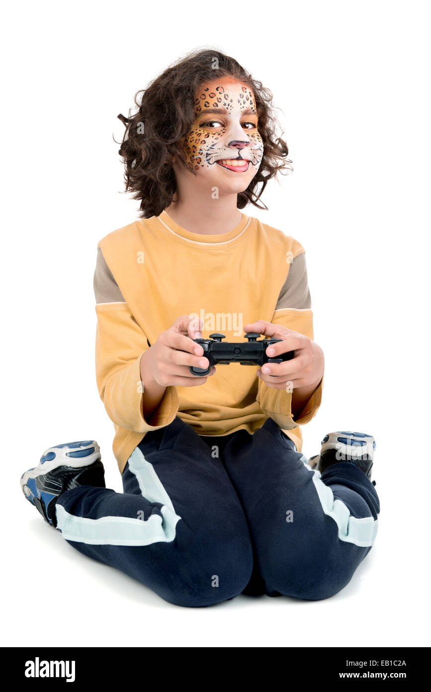 Girl with painted face playing video games isolated in white Stock ...
