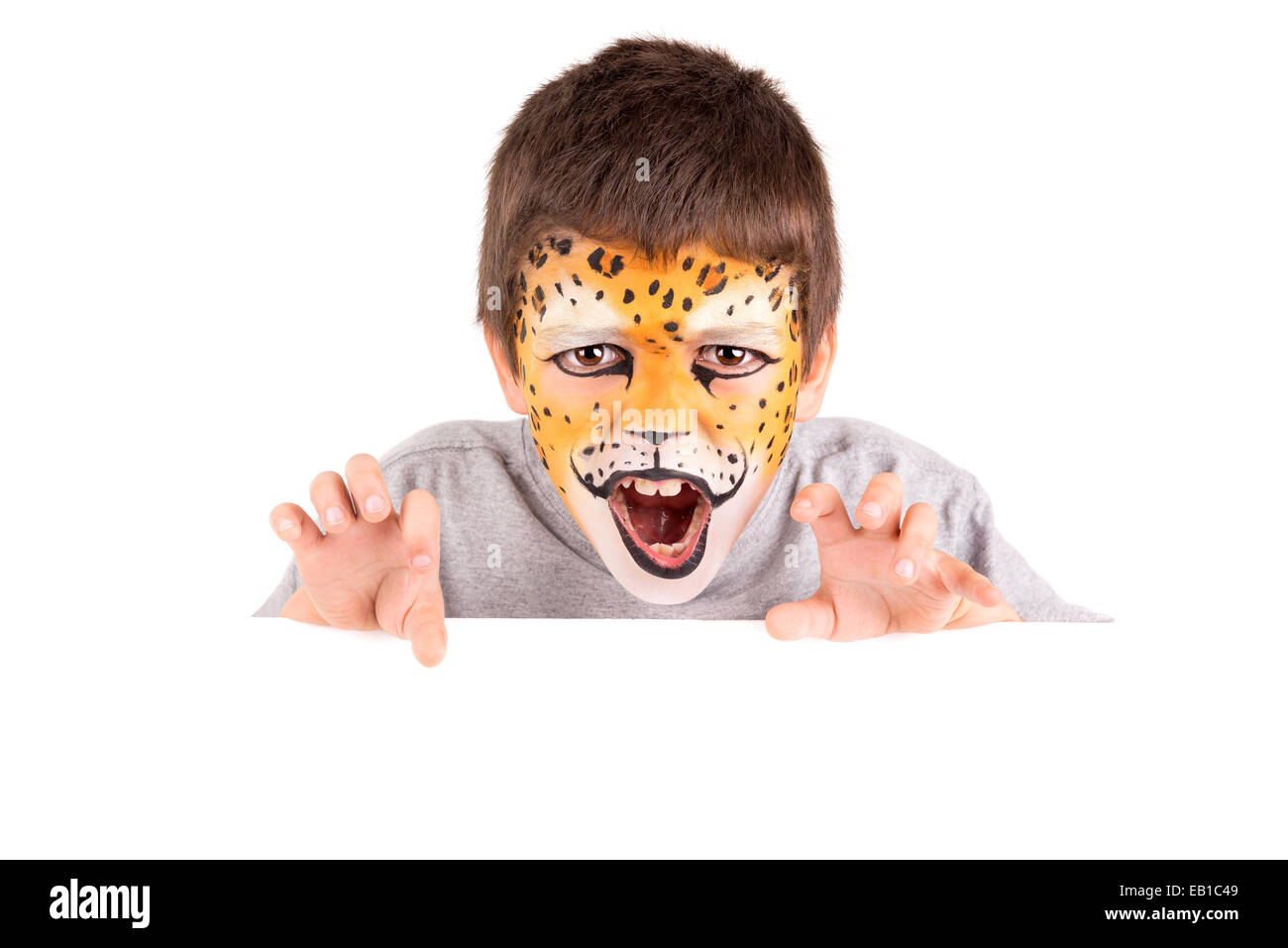 Boy with face-painted like a leopard isolated in white Stock Photo - Alamy