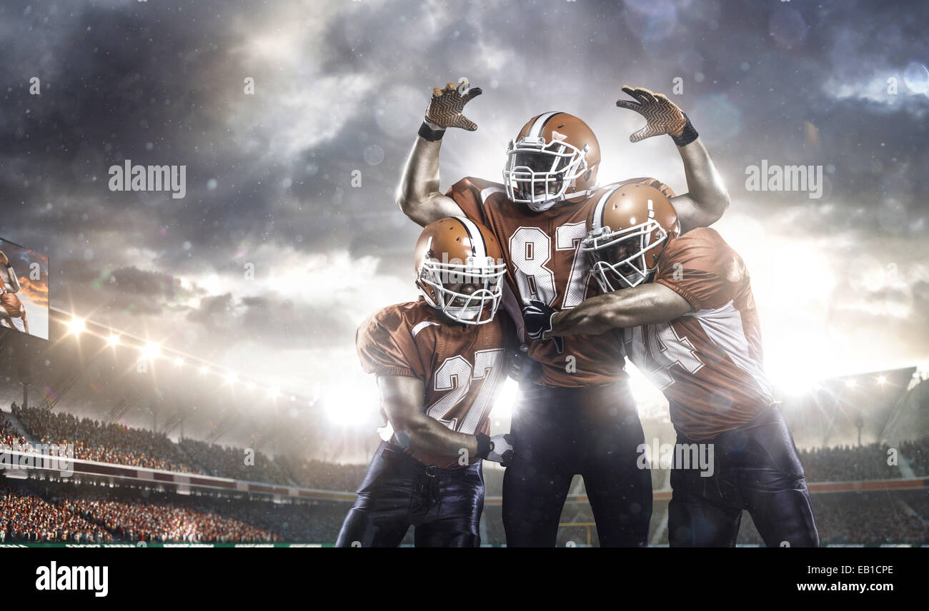 American football players in action on the stadium Stock Photo - Alamy