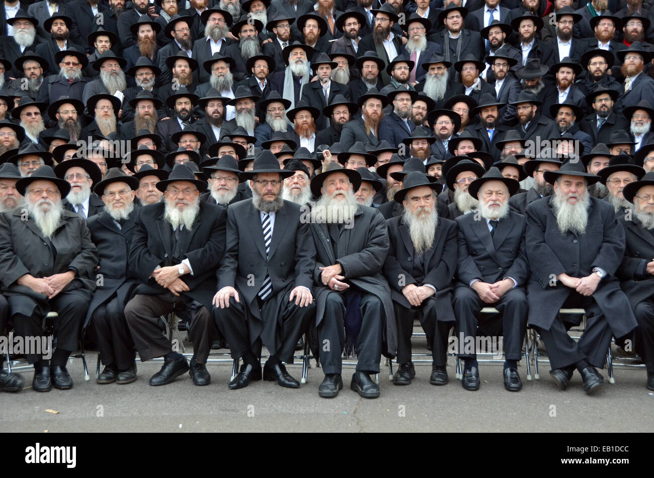 Some of the thousands of orthodox rabbis seated preparing for a group ...