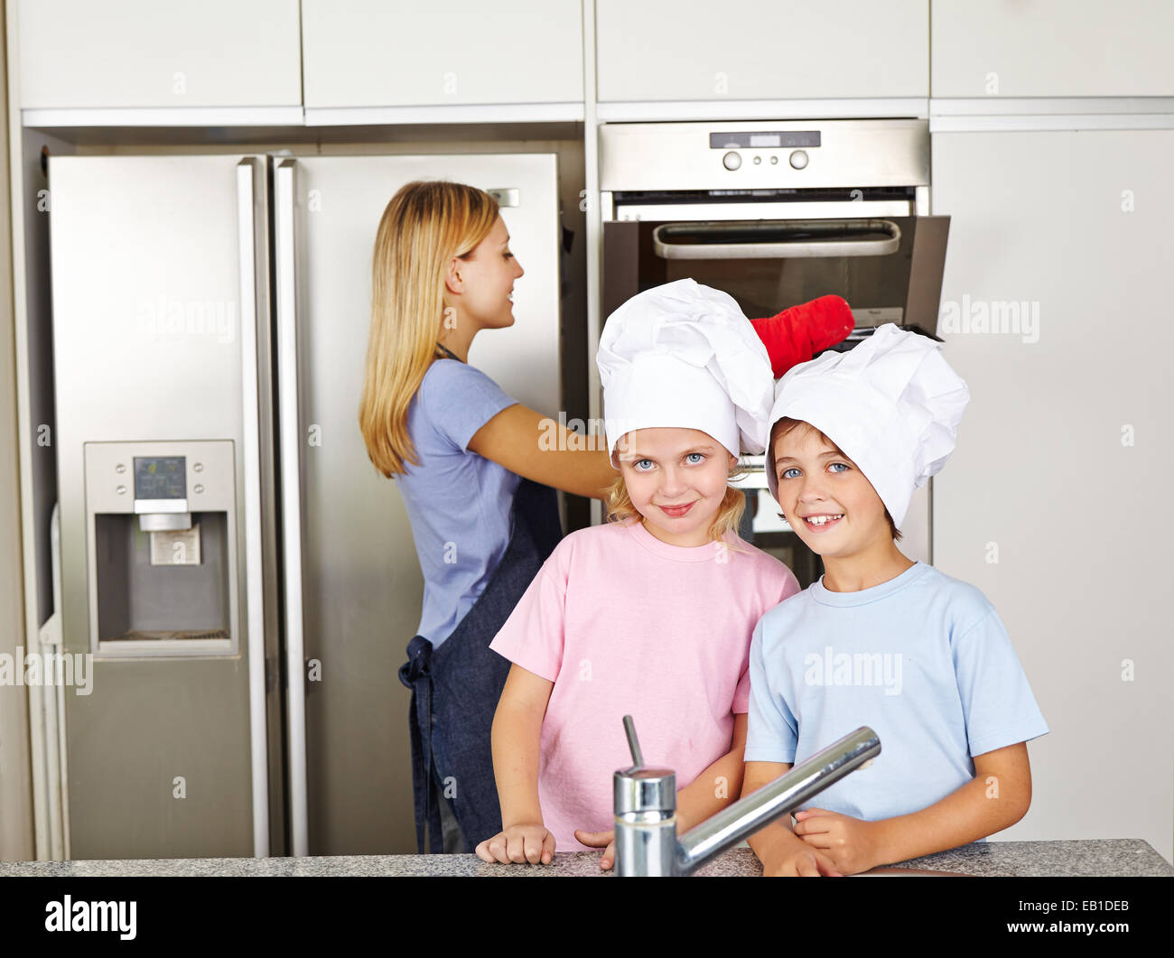 Woman cooking with chefs hat hi-res stock photography and images - Alamy