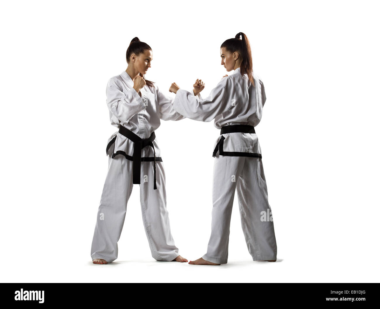 Karate woman in action isolated on white background Stock Photo - Alamy