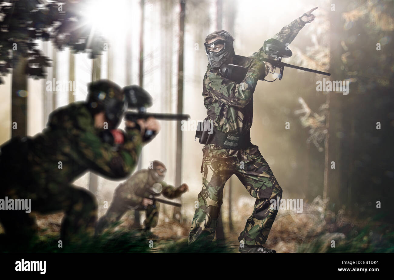 Paintball team in action rainy forest location Stock Photo - Alamy