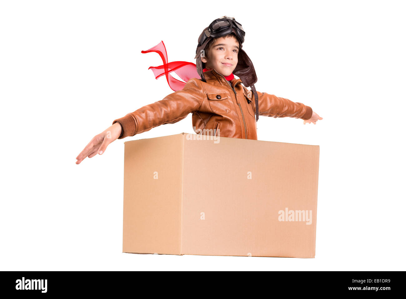 Young boy pilot flying a cardboard box isolated in white Stock Photo ...