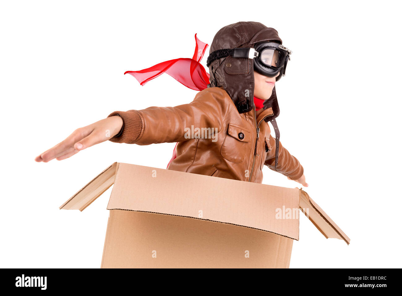 Young boy pilot flying a cardboard box isolated in white Stock Photo ...