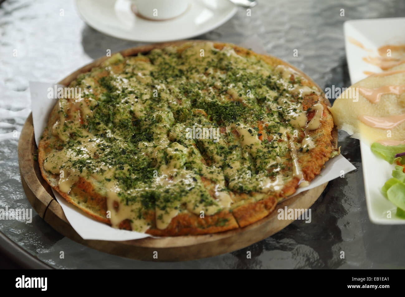 Pizza Japanese style in a cafe Stock Photo - Alamy