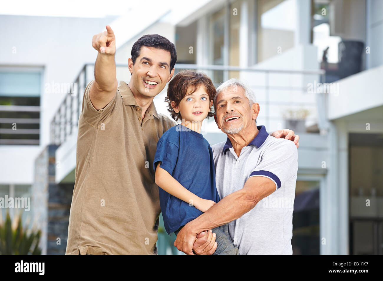 Father of family with son and grandfather showing future goal Stock ...