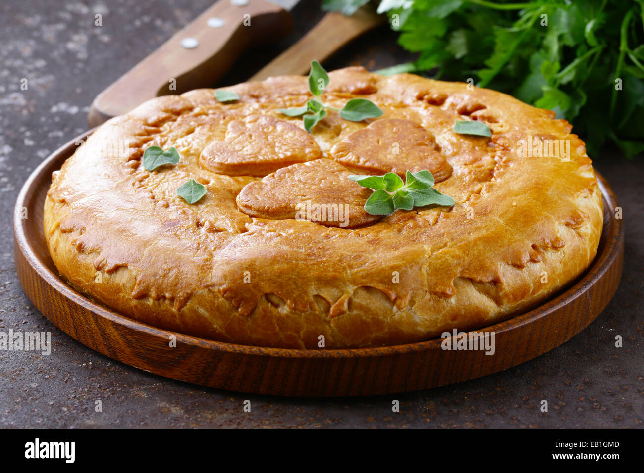 homemade meat pie with potatoes and oregano Stock Photo - Alamy