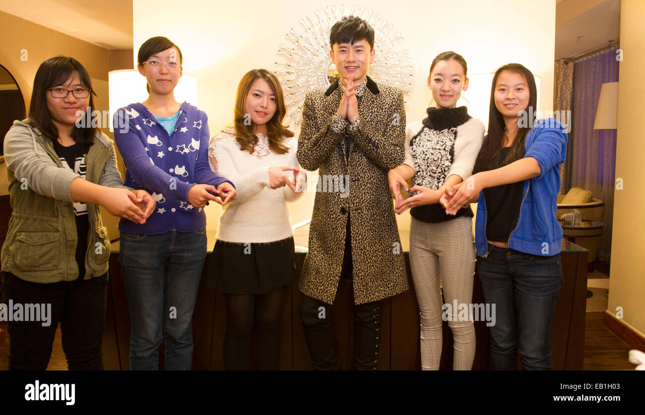 Los Angeles, USA. 23rd Nov, 2014. Chinese singer Zhang Jie (3rd R ...