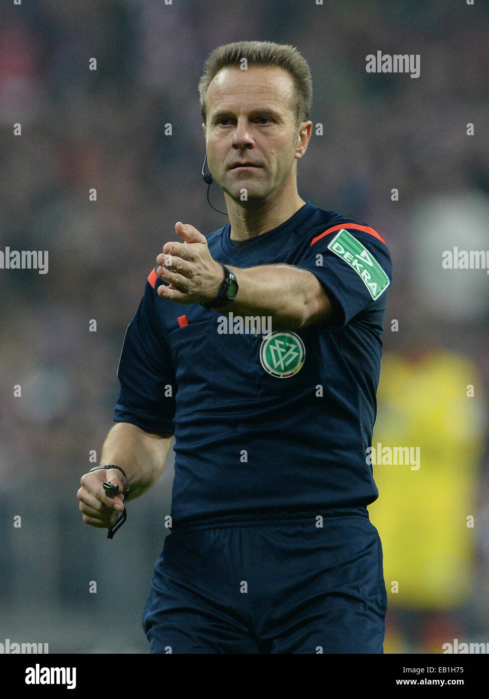 Munich, Germany. 22nd Nov, 2014. Referee Peter Gagelmann reacts during ...