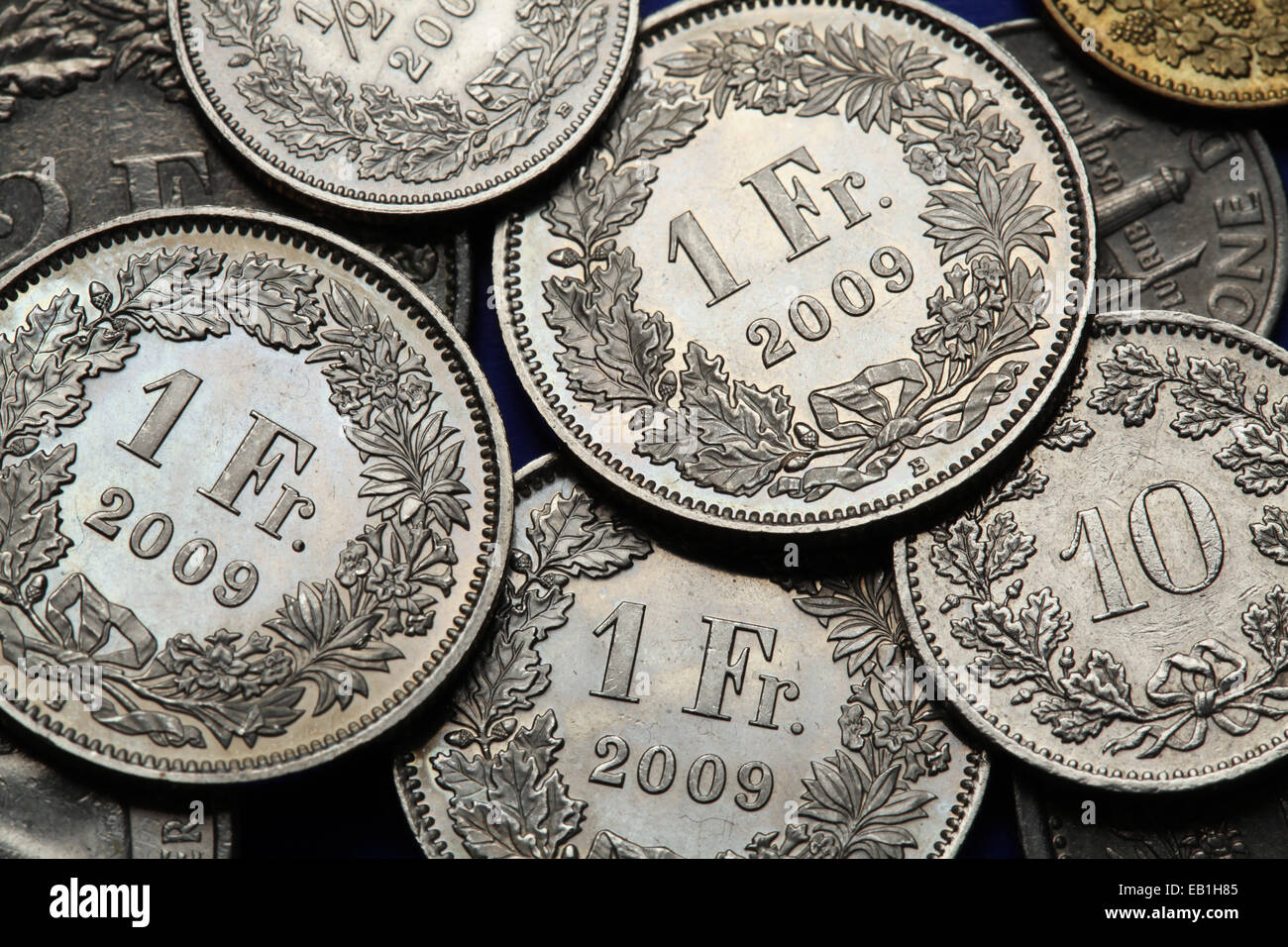 Coins of Switzerland. Swiss one franc coins Stock Photo - Alamy