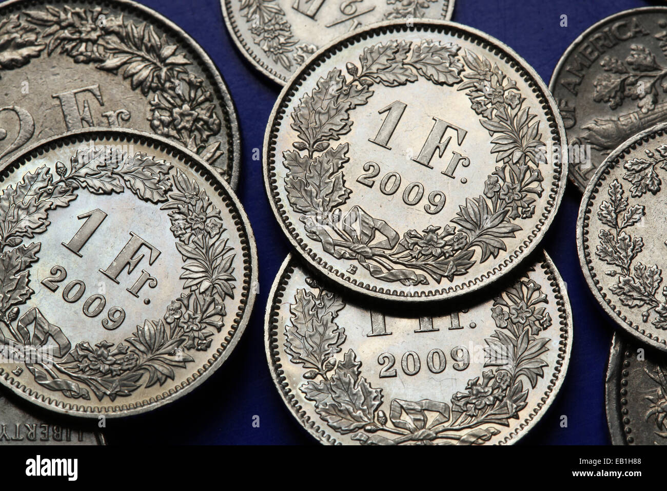 Coins of Switzerland. Swiss one franc coins Stock Photo - Alamy